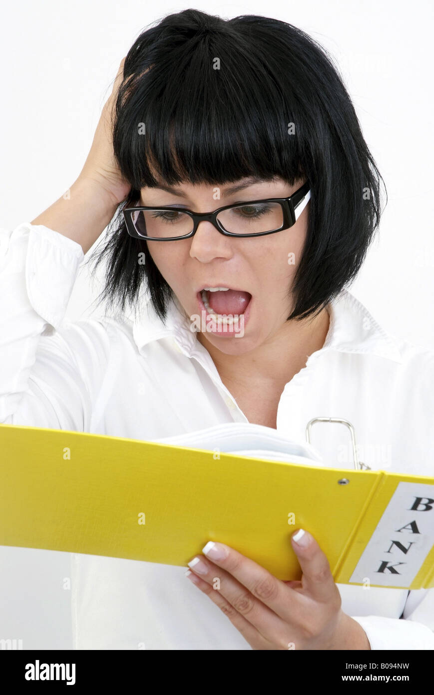 shocked woman with bank statement Stock Photo - Alamy