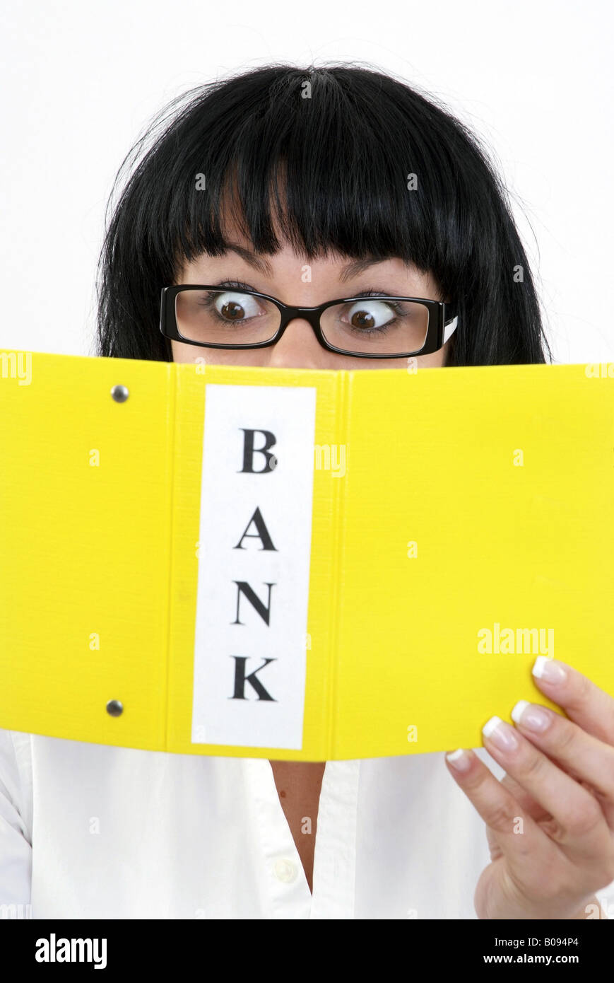 shocked woman with bank statement Stock Photo - Alamy