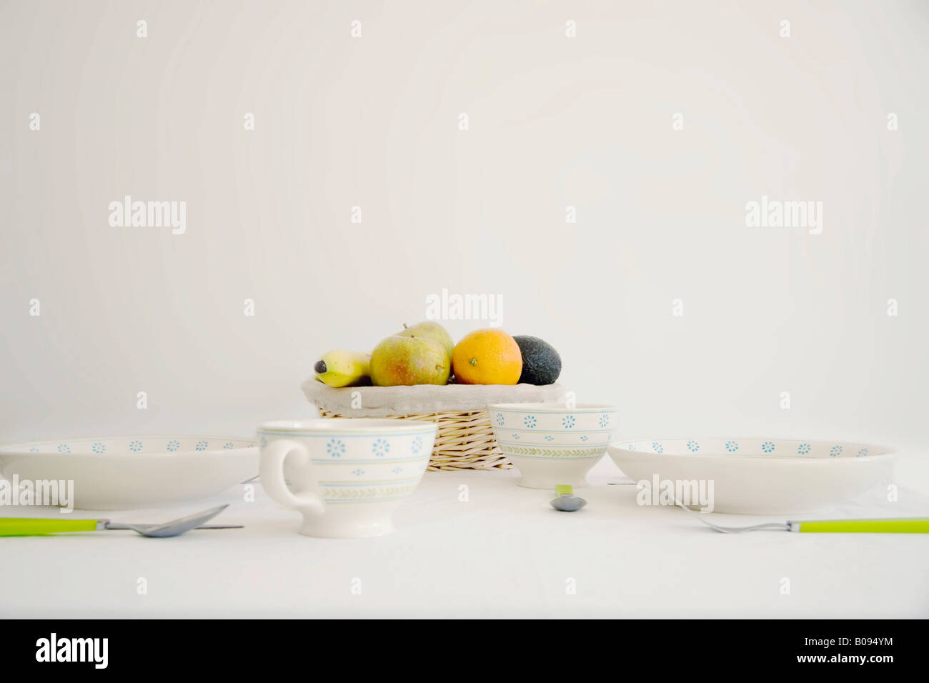 Table setting with fruit bowl Stock Photo - Alamy