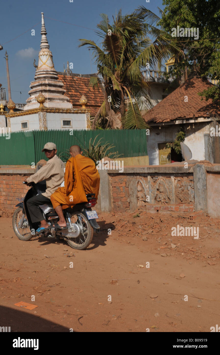 Motorcycle driver with a monk, heading to temple, phnom penh Stock ...