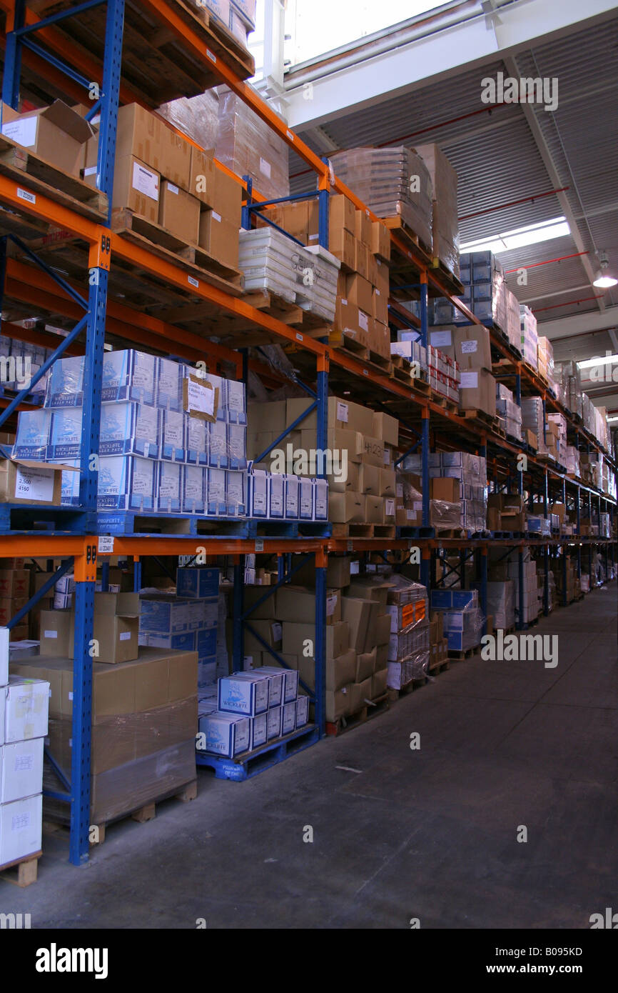 Shelves with cartons of paper and brochures in a warehouse Stock Photo ...