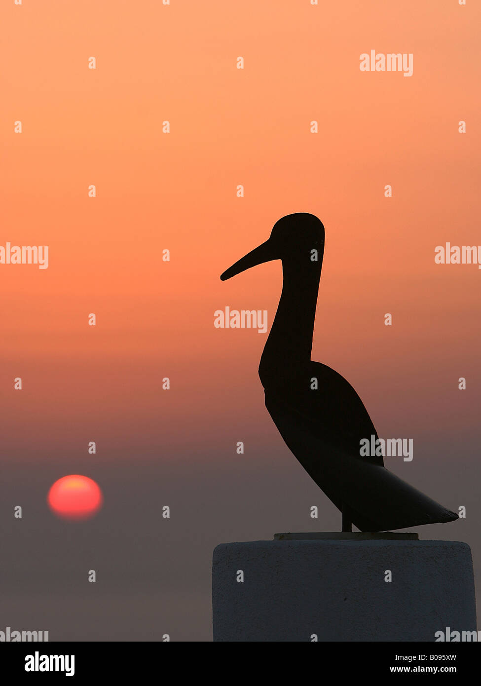 Bird sculpture on a roof, glowing sun, Oia, Santorini, Greece Stock ...