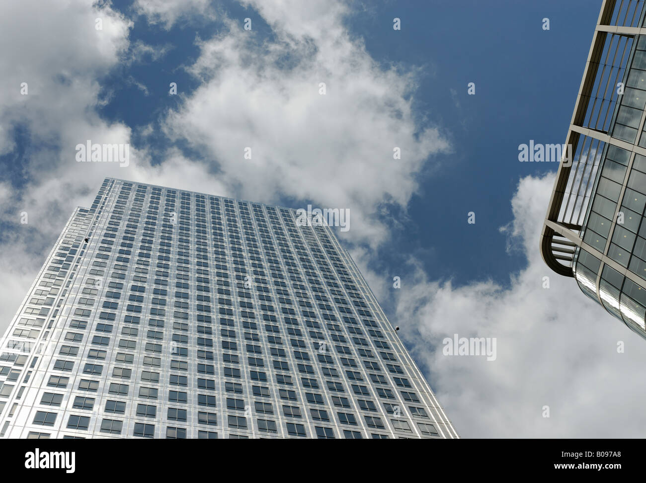 Skyscraper against a cloudy blue sky Stock Photo - Alamy