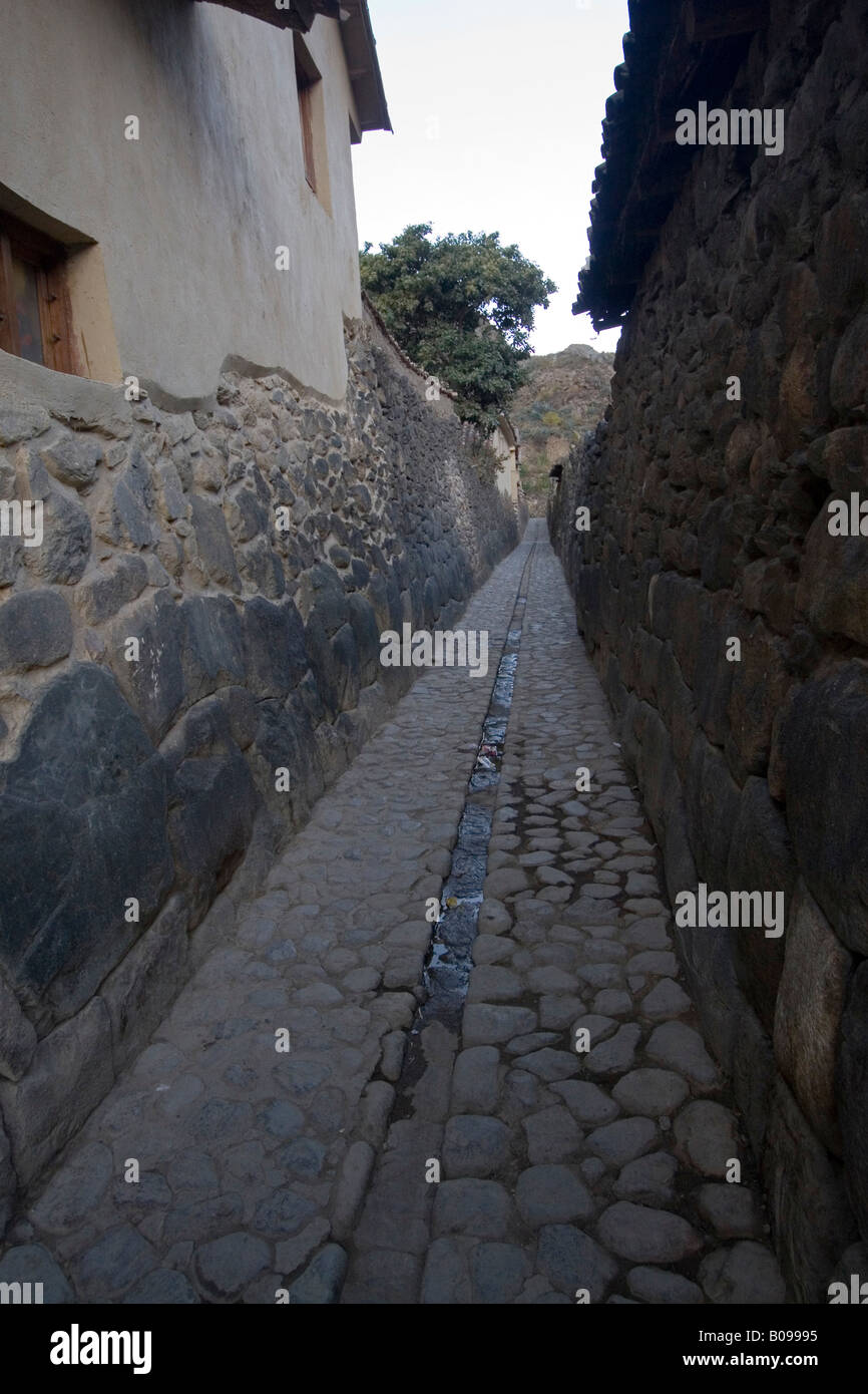 South America - Peru. Cobblestone street with drainage channel and Inca ...