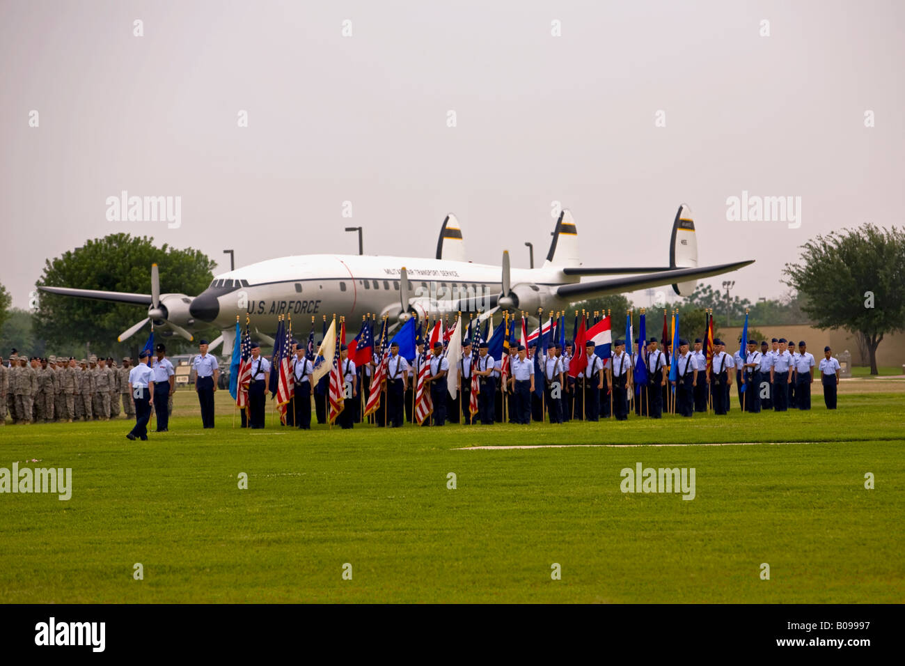 USAF Airmen in formation with state flags in front of aircraft Stock ...