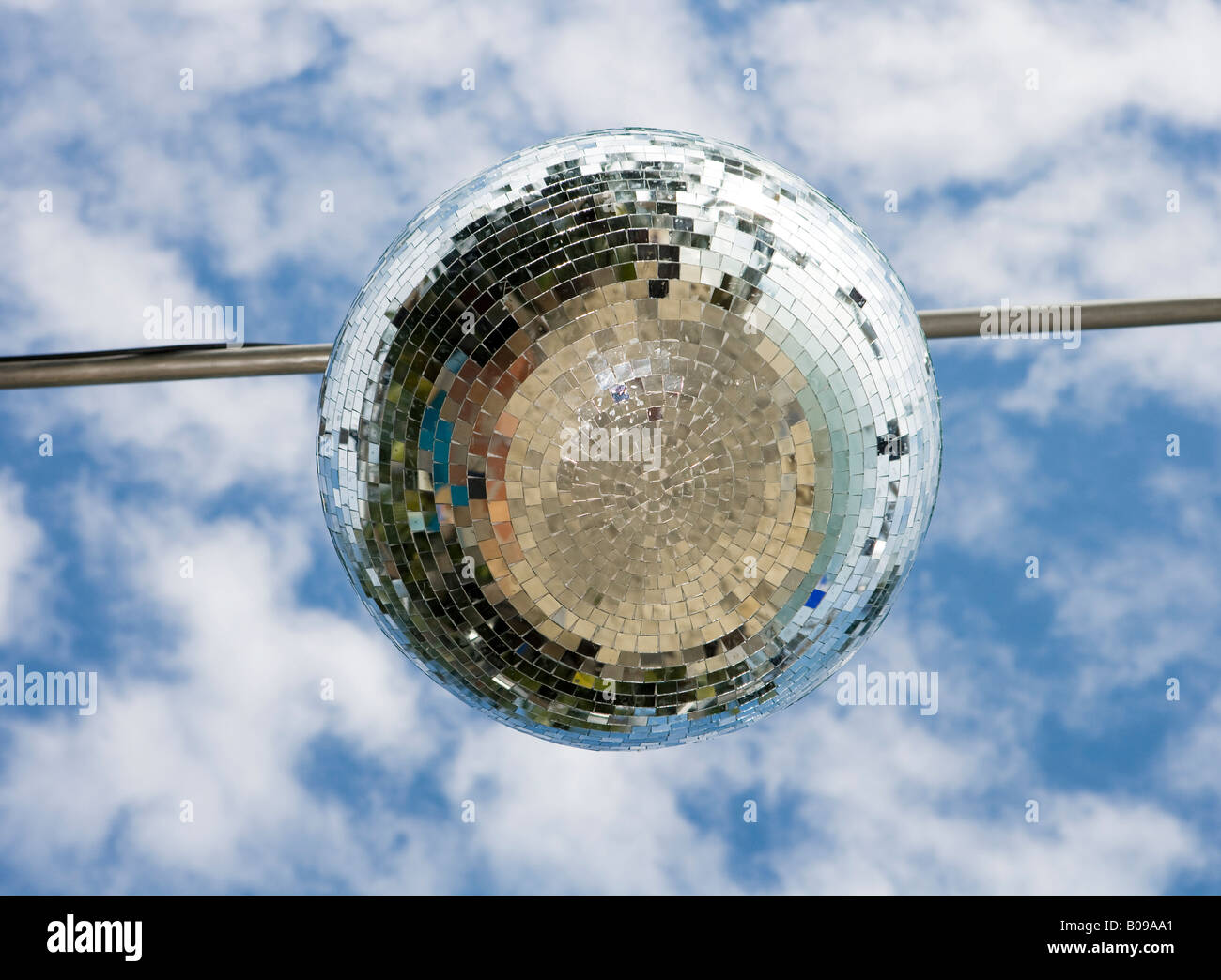 Discoball in front of fluffy clouds Stock Photo - Alamy