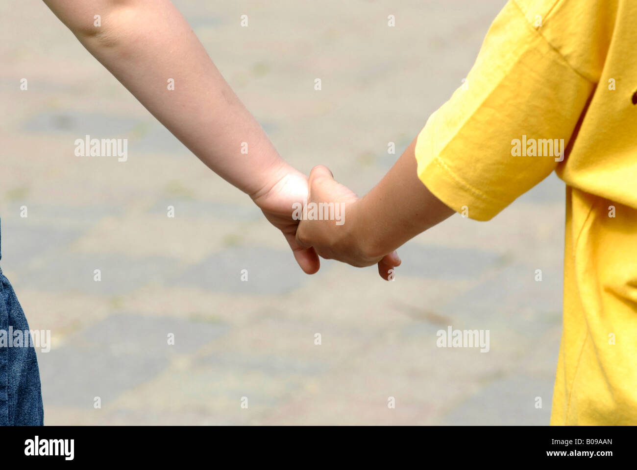 Close-up of children holding hands Stock Photo - Alamy