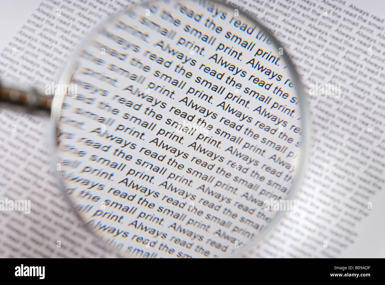 Stock photo showing a magnifying glass over a sheet of paper Stock ...