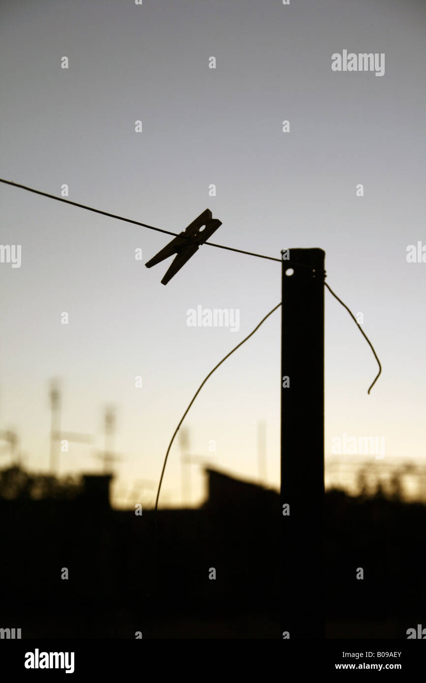 one peg on empty clothes line in city Stock Photo - Alamy
