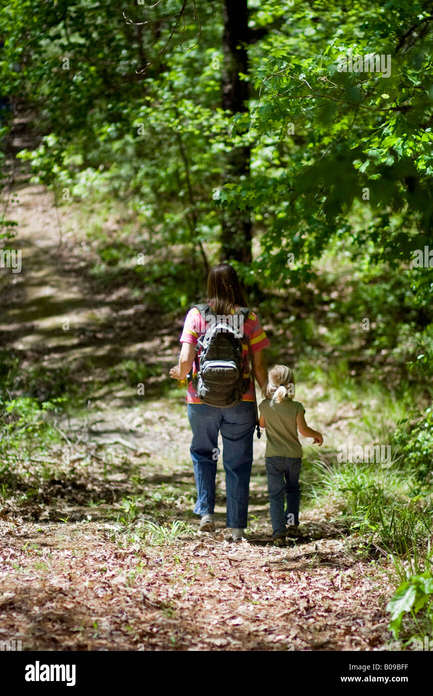 Mother and daughter walking down path Stock Photo - Alamy