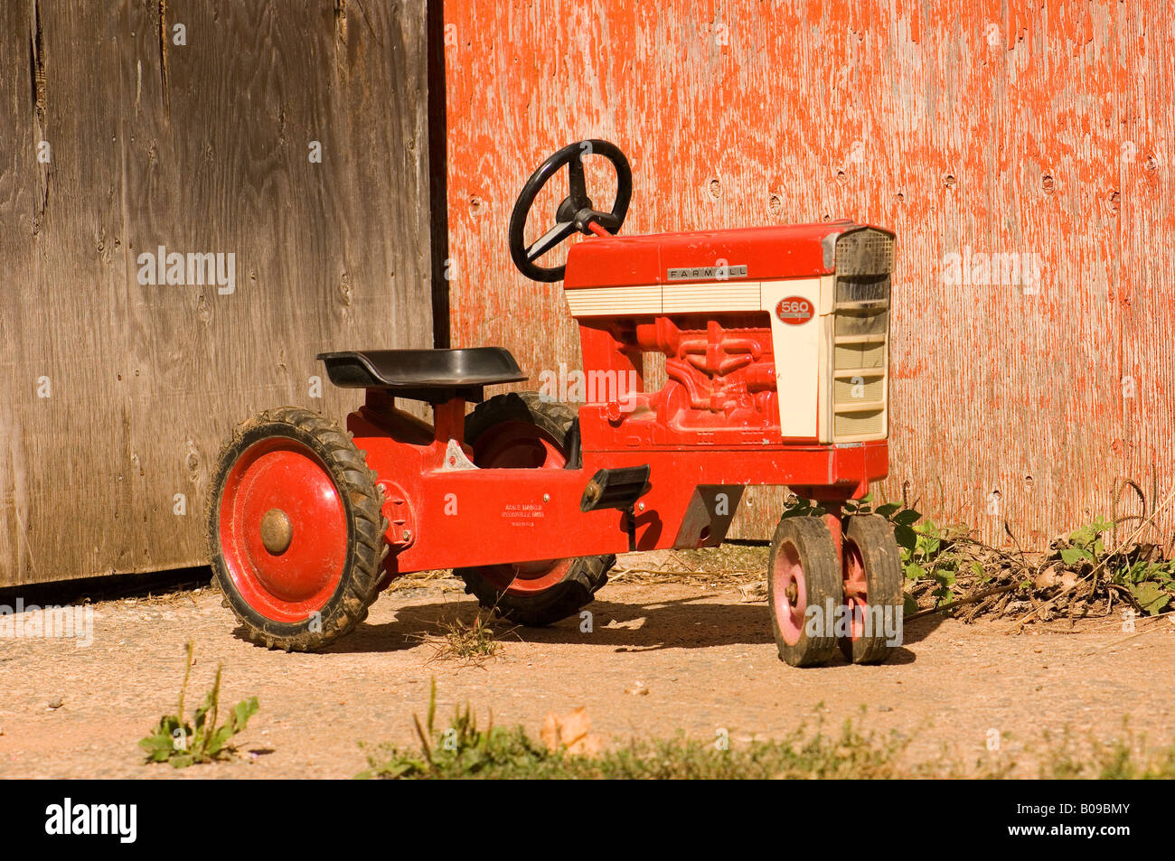 A red farmers tractor Stock Photo - Alamy
