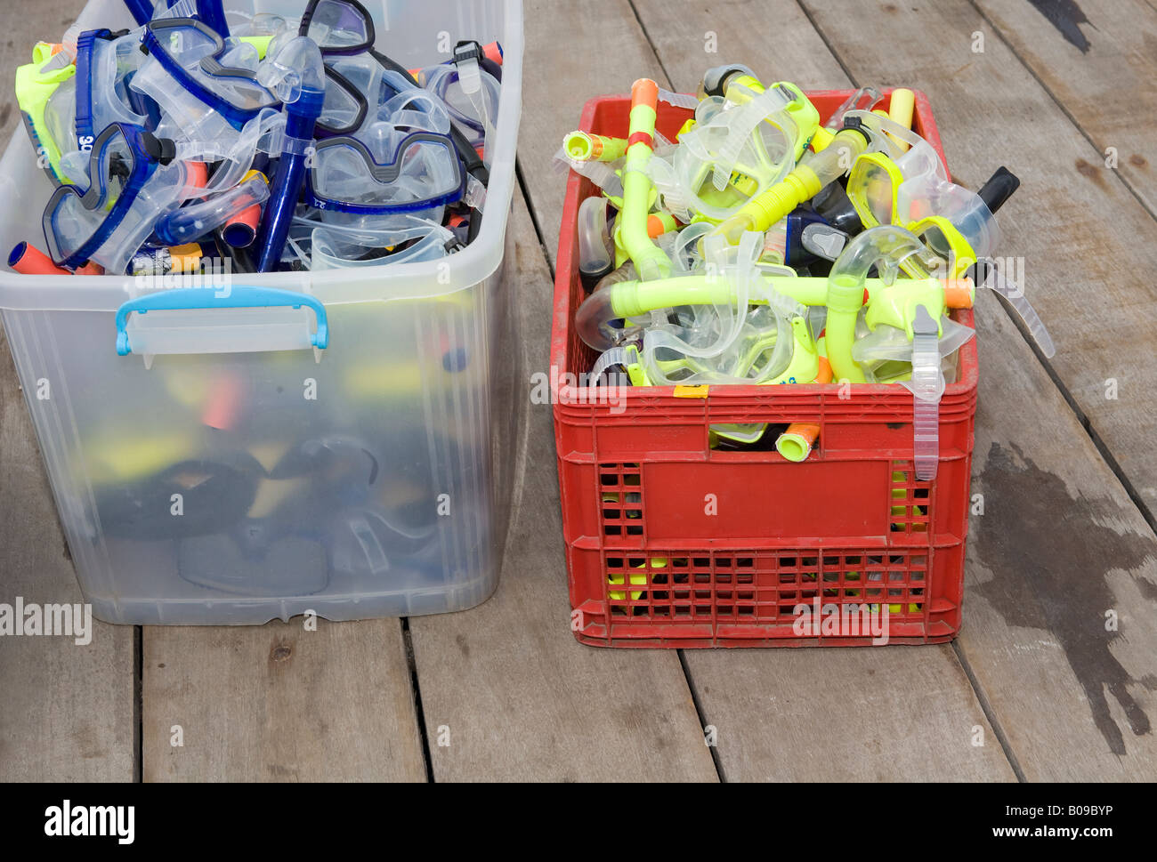 Diver goggles and snorkels in boxes on a wooden deck Stock Photo - Alamy