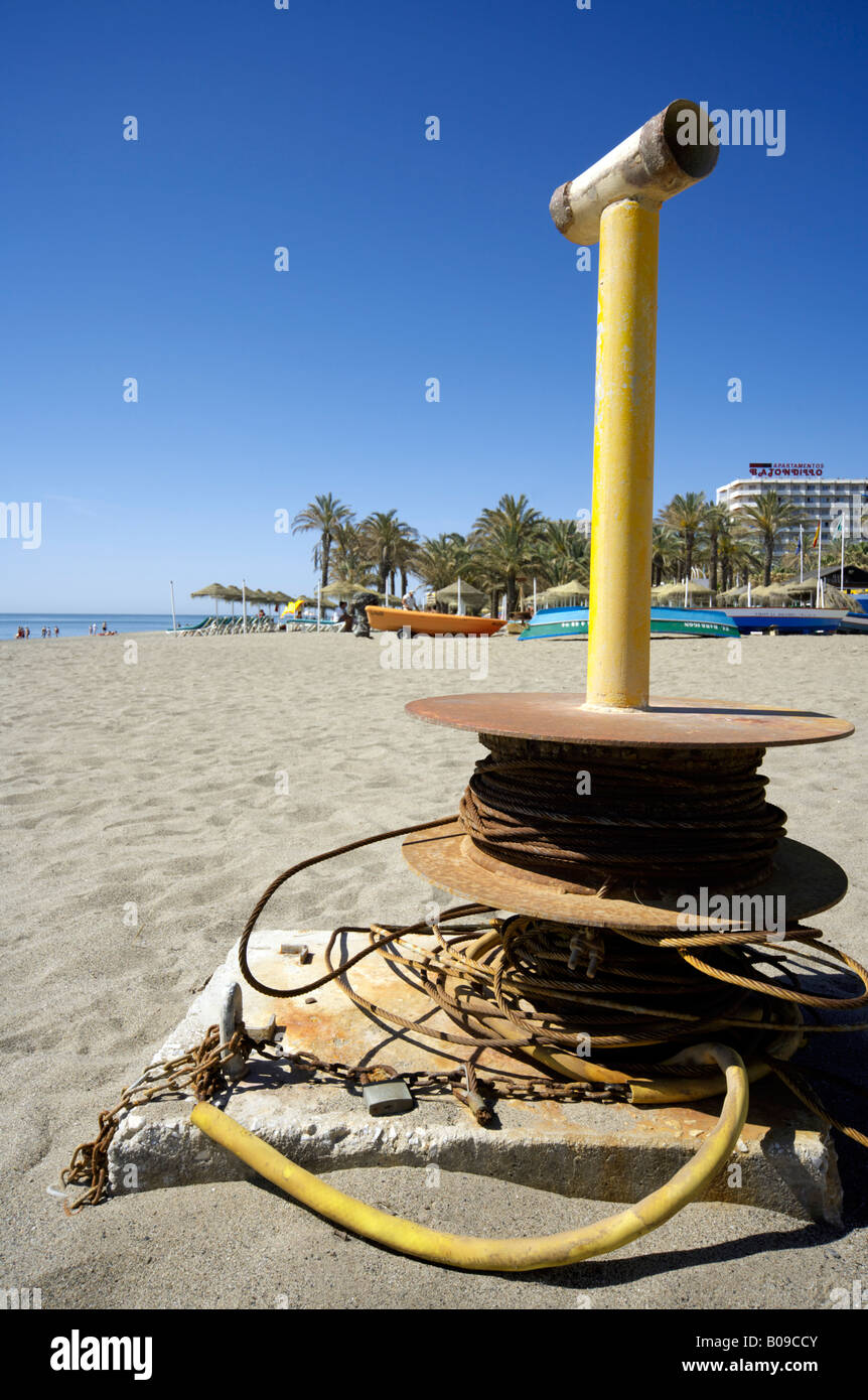 Old rusty boat winch on the beach at Torremolinos, Mediterranean Sea ...