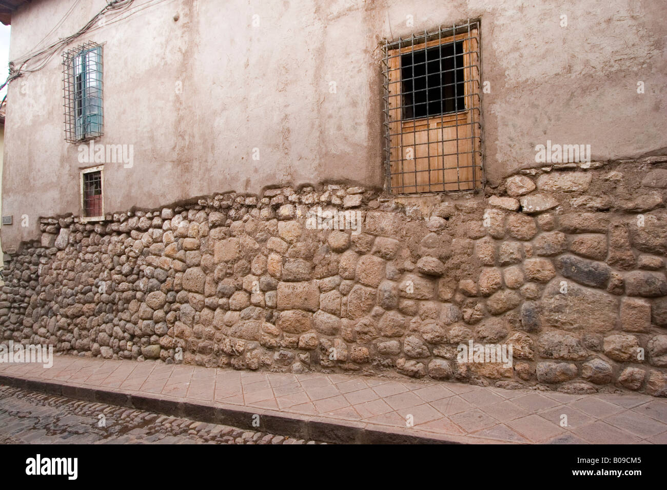 South America - Peru. Old Inca wall foundation along cobblestone street ...