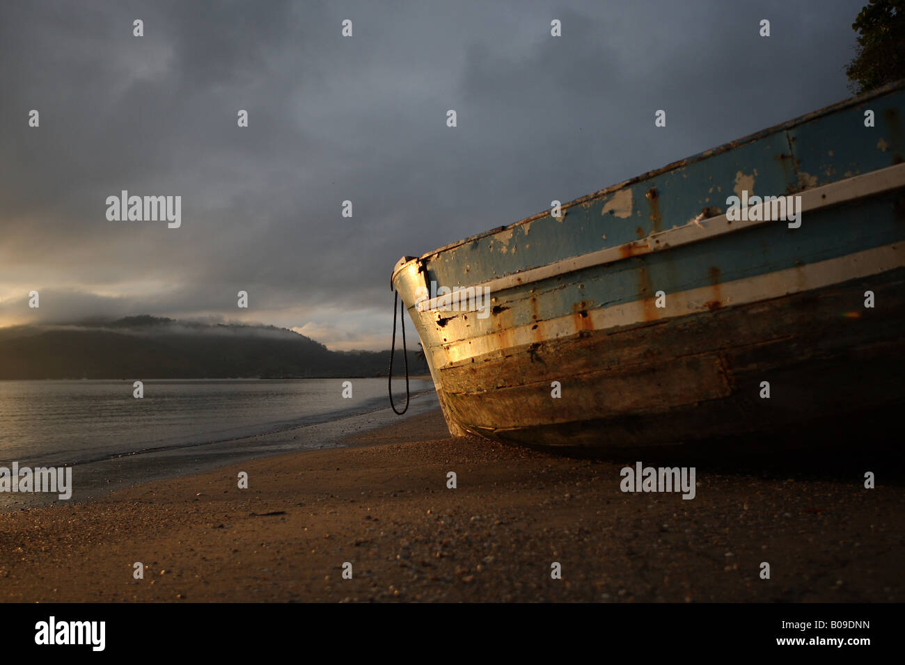 boat on beach at dawn Stock Photo - Alamy