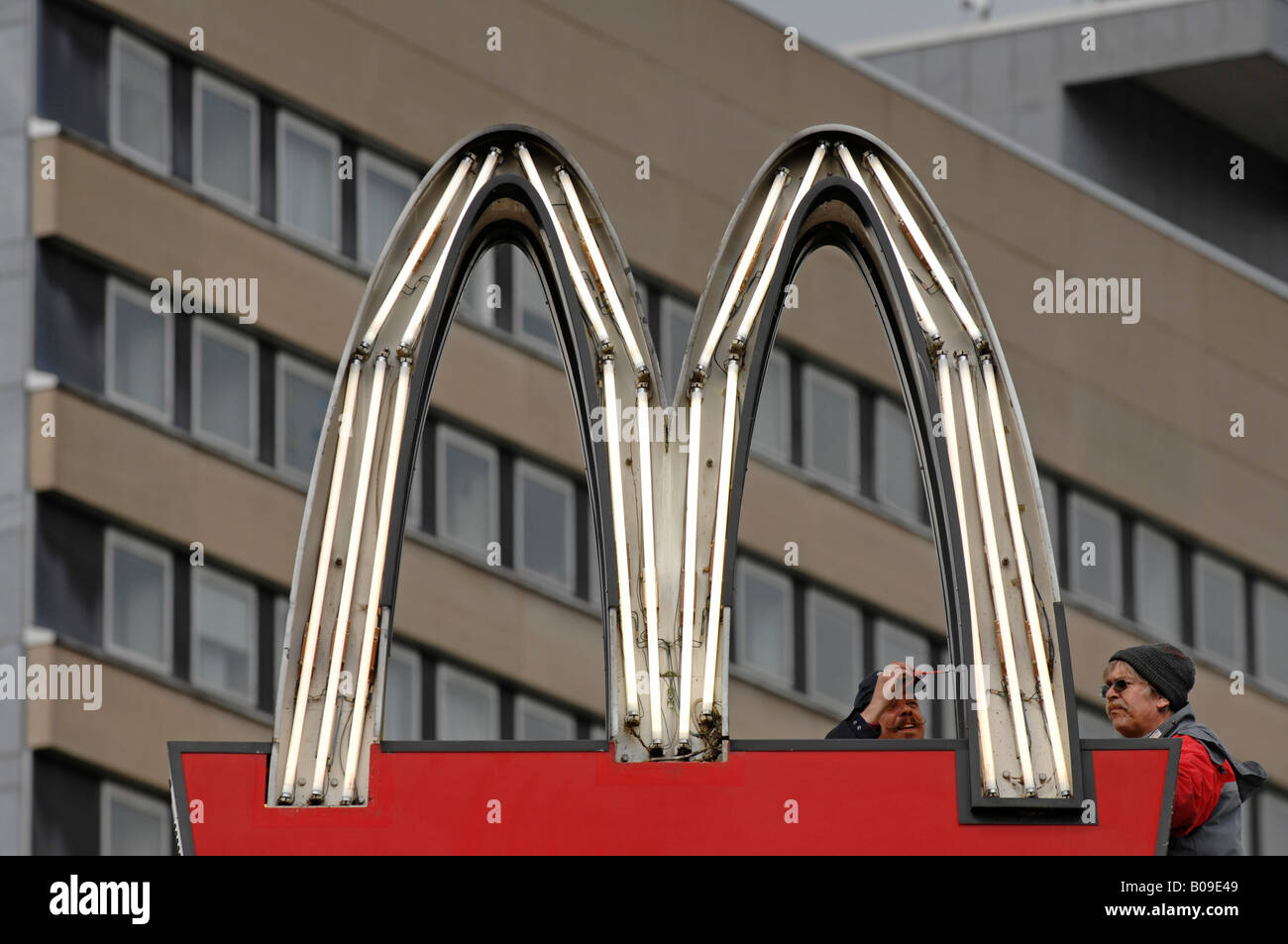 Mc Donalds neon sign gets repaired Stock Photo - Alamy