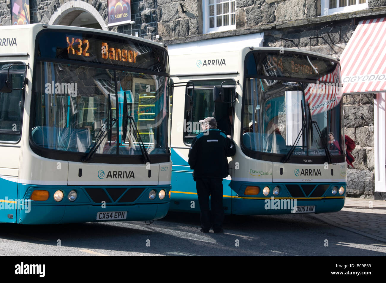 Two Arriva wales company buses waiting for passengers Dolgellau Gwynedd ...