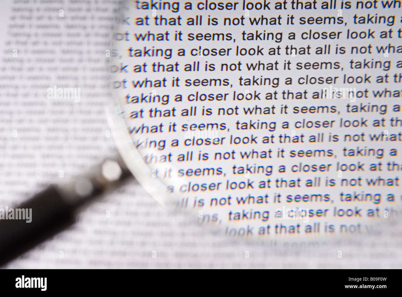 Stock photo showing a magnifying glass over a sheet of paper Stock ...