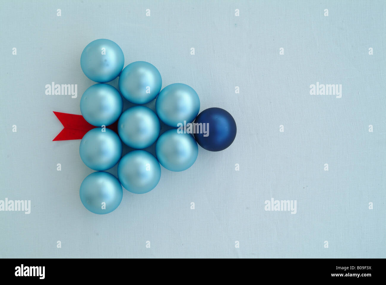 A arrow of blue balls Stock Photo - Alamy