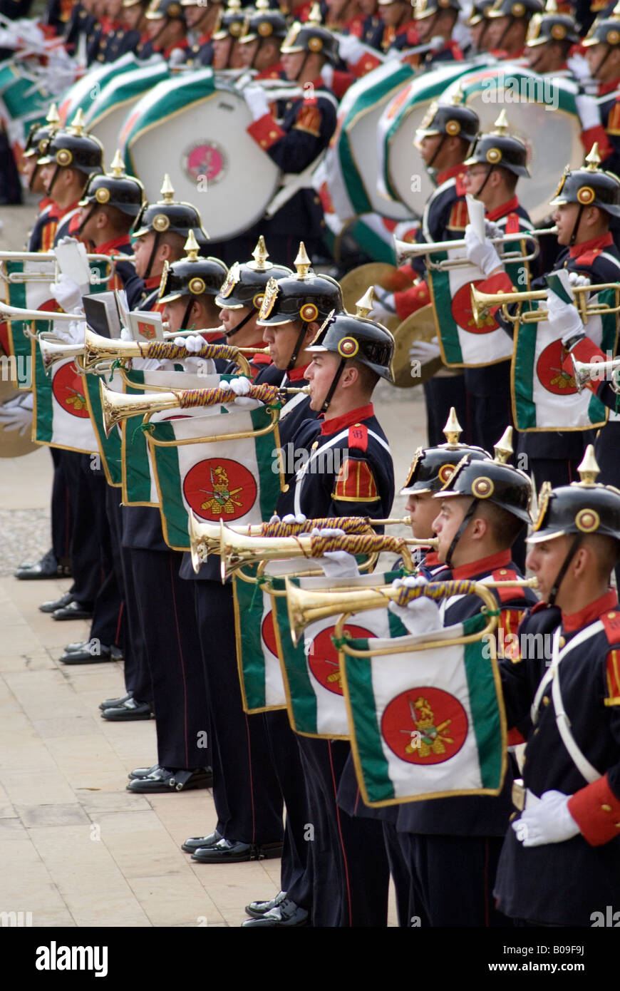 Military band playing trumpets during a parade in the grounds of the ...