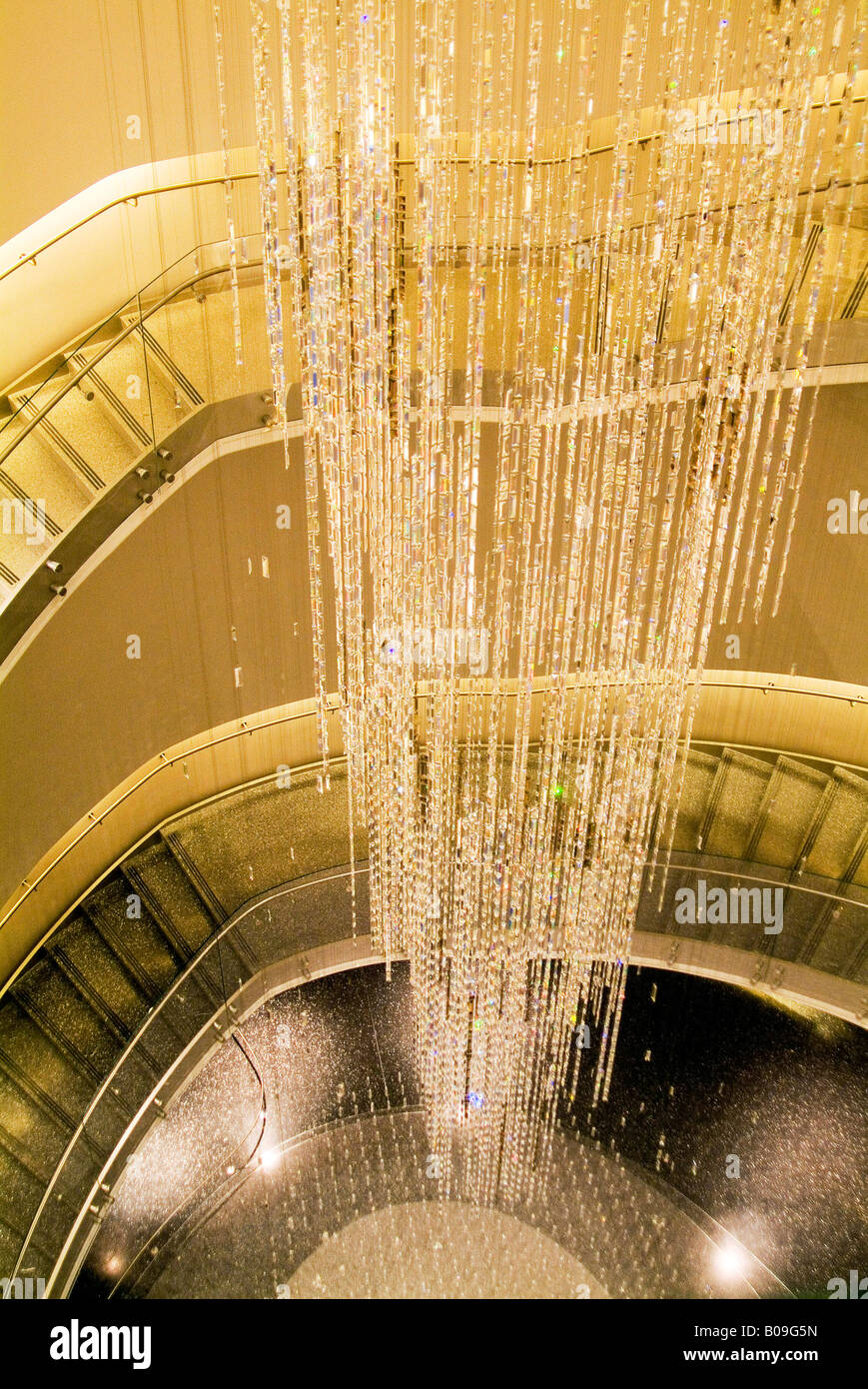 Winding staircase and chandelier in center Stock Photo - Alamy