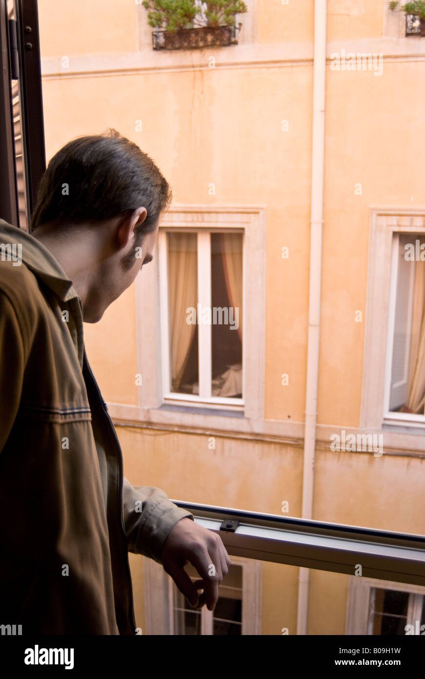 Man standing in room from behind hi-res stock photography and images ...