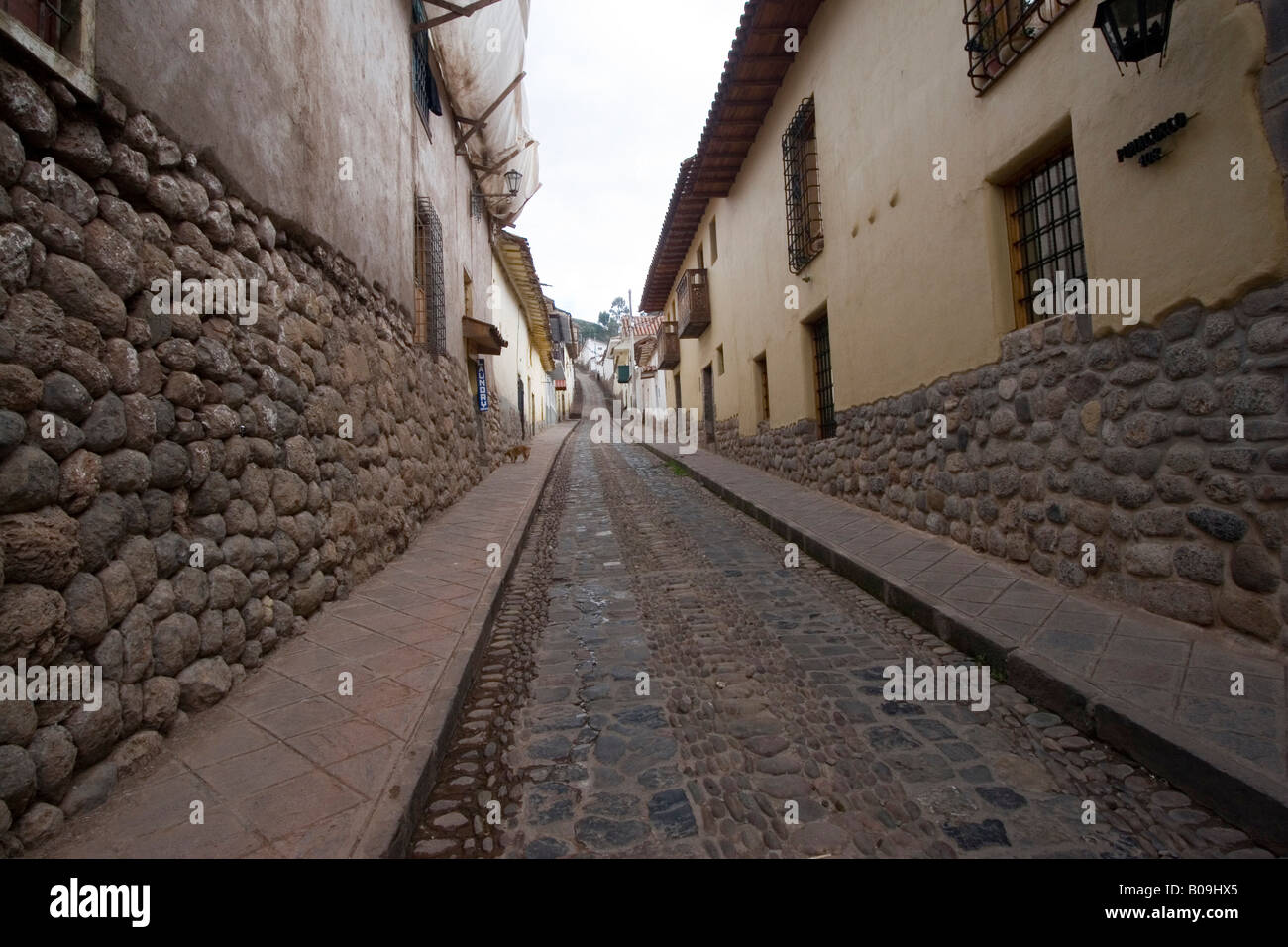 South America - Peru. Old Inca wall foundation along cobblestone street ...