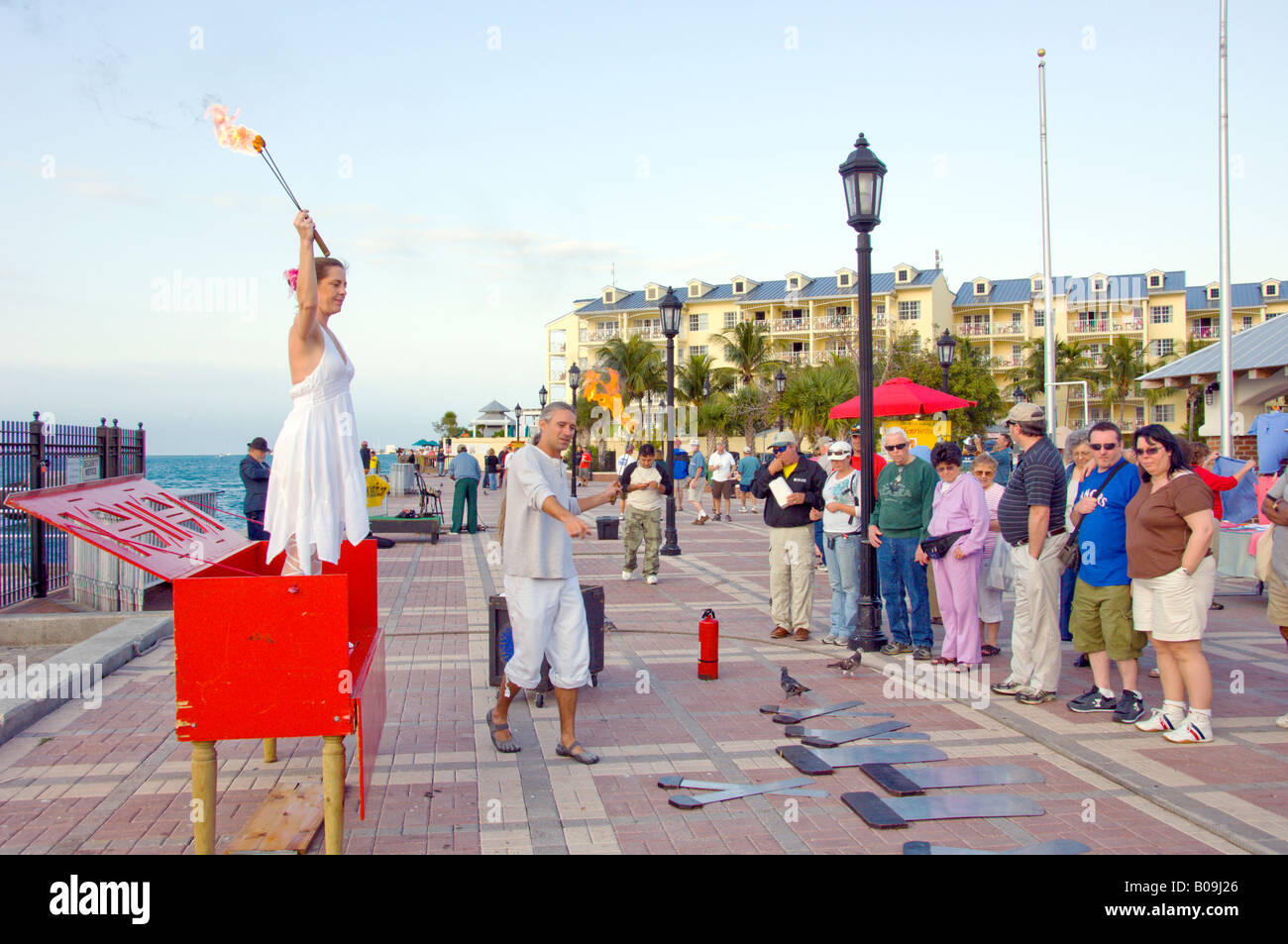 Fire eating buskers entertaining on Mallory Pier at sunset Key West ...