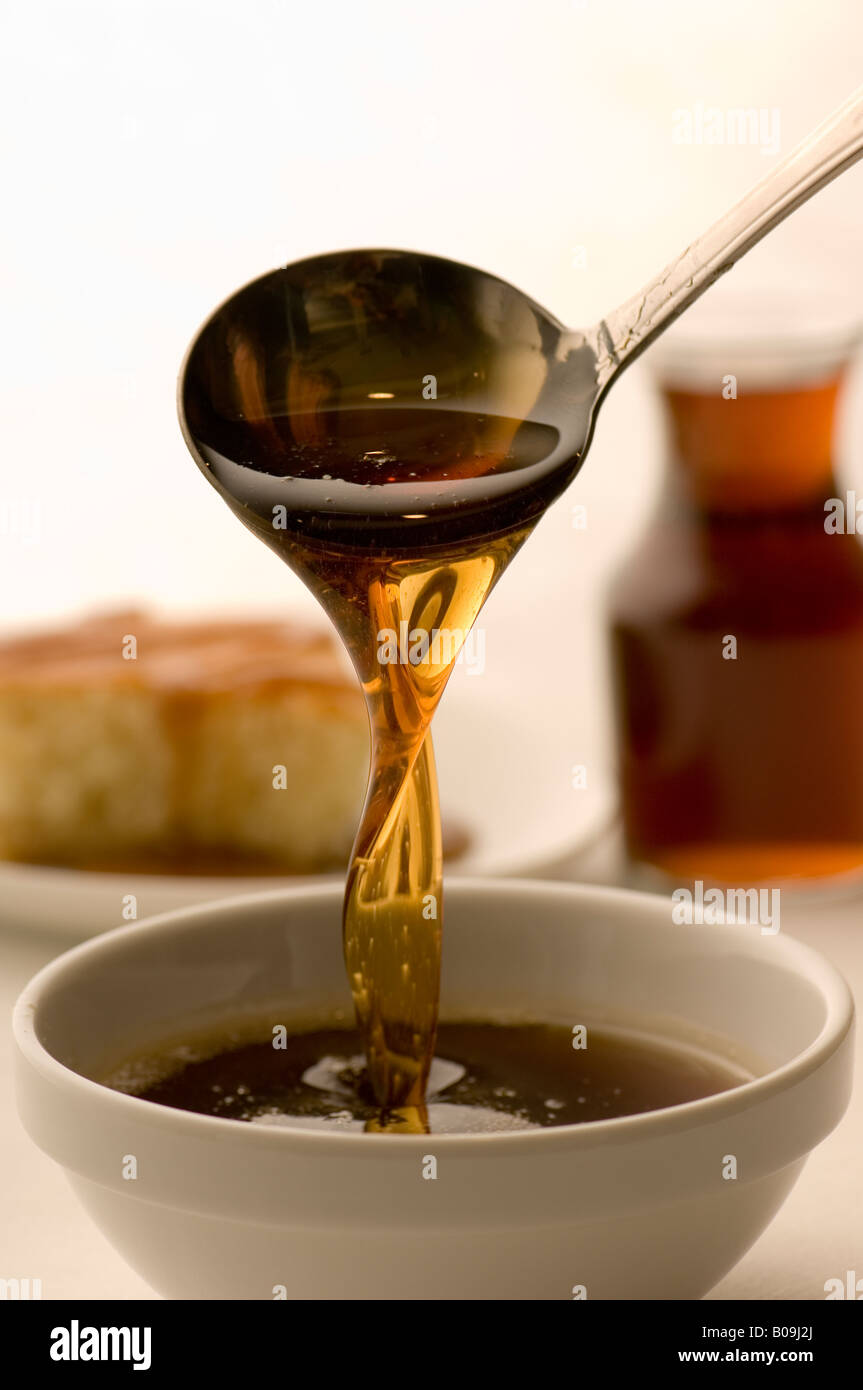 Syrup pouring from a ladle Stock Photo - Alamy