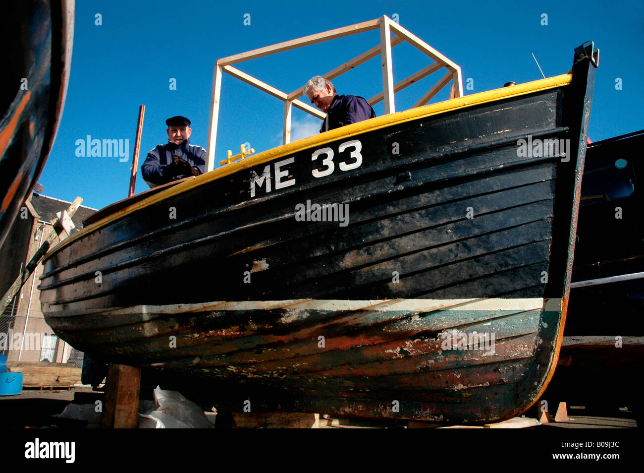 Men work on boats on hi-res stock photography and images - Alamy