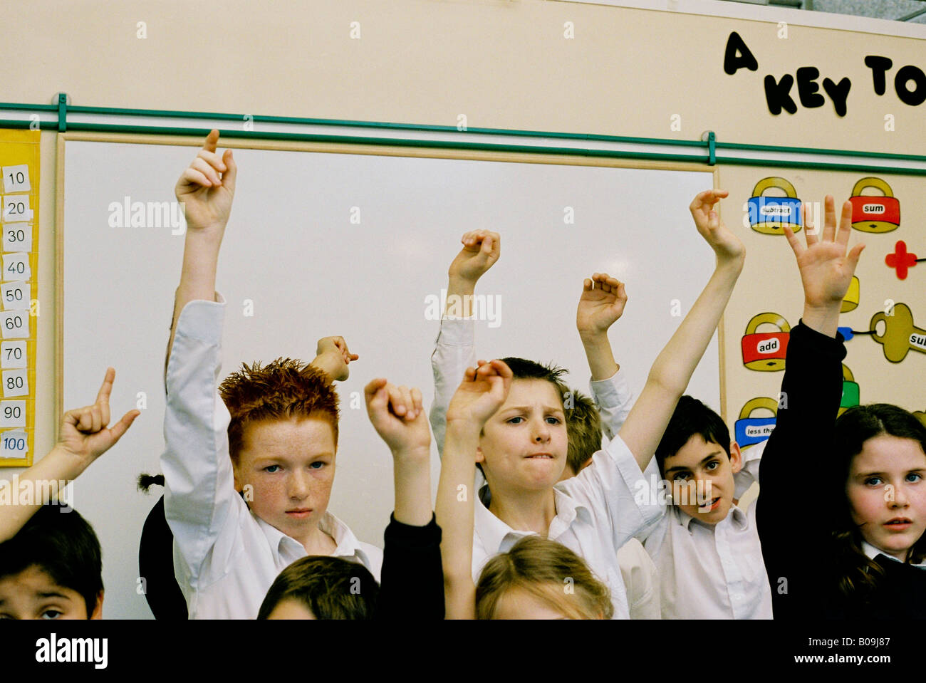 Primary school hands pupils up in hi-res stock photography and images ...