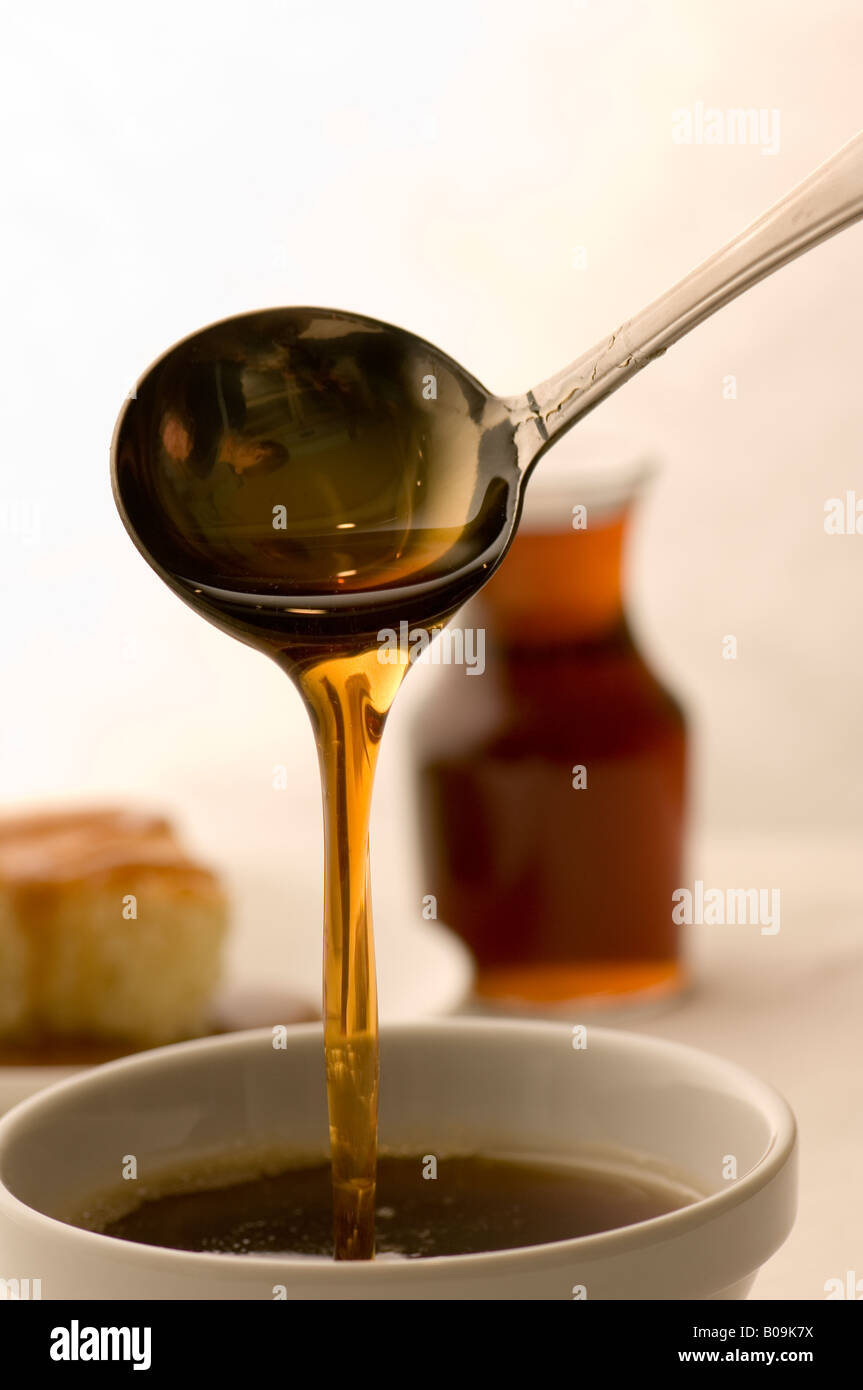 Syrup pouring from a ladle Stock Photo - Alamy