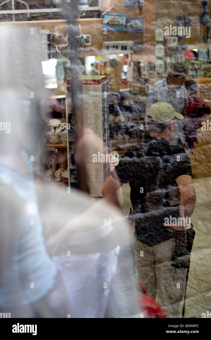 Store shoppers and window reflections Stock Photo - Alamy