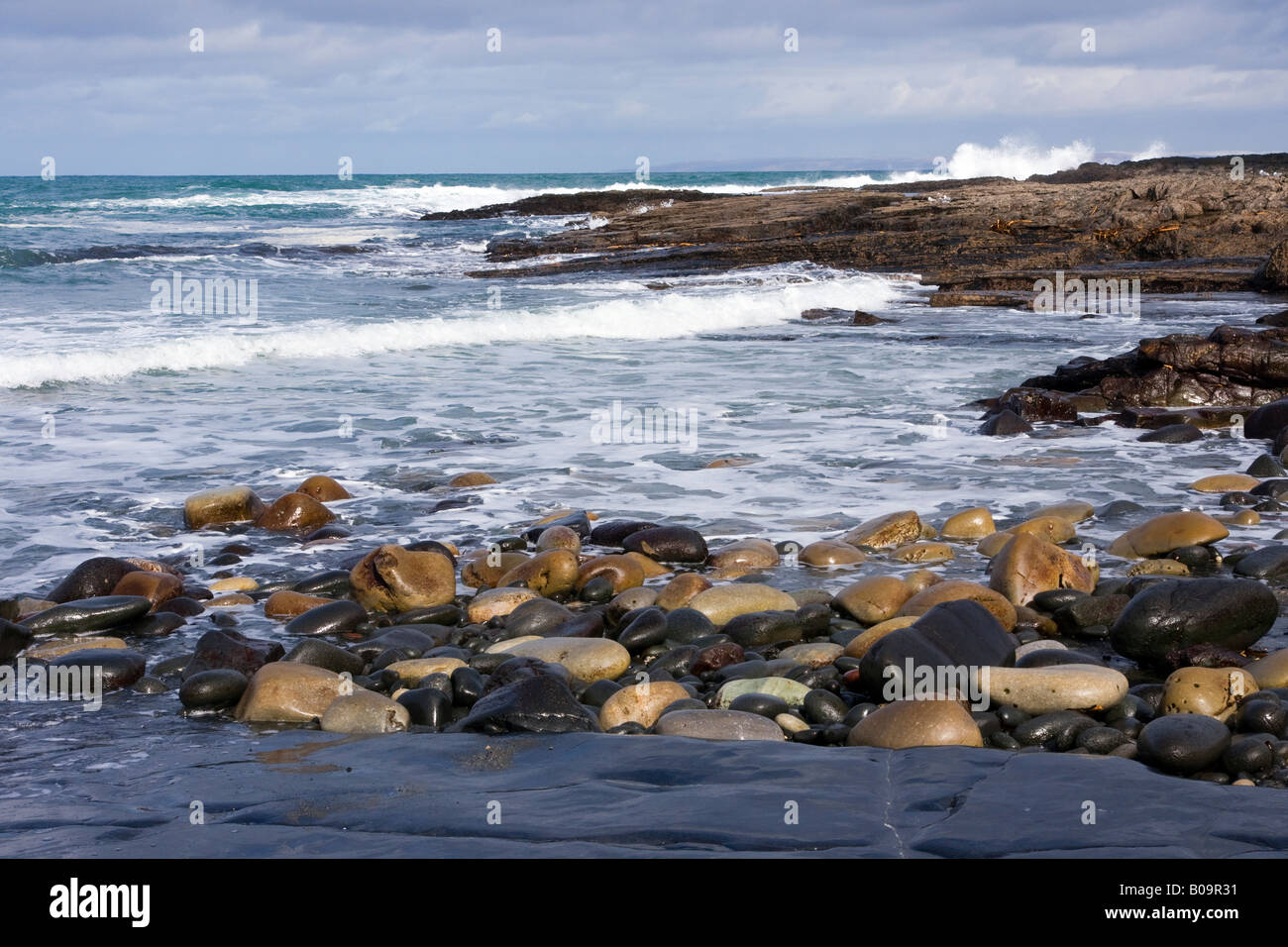 incoming waves sea and surf on a trotternish beach shoreline with sun ...