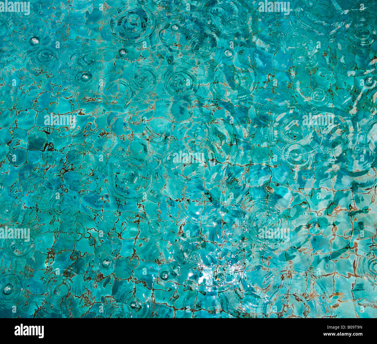 Green-blue pool water with bubbles and drops Stock Photo - Alamy