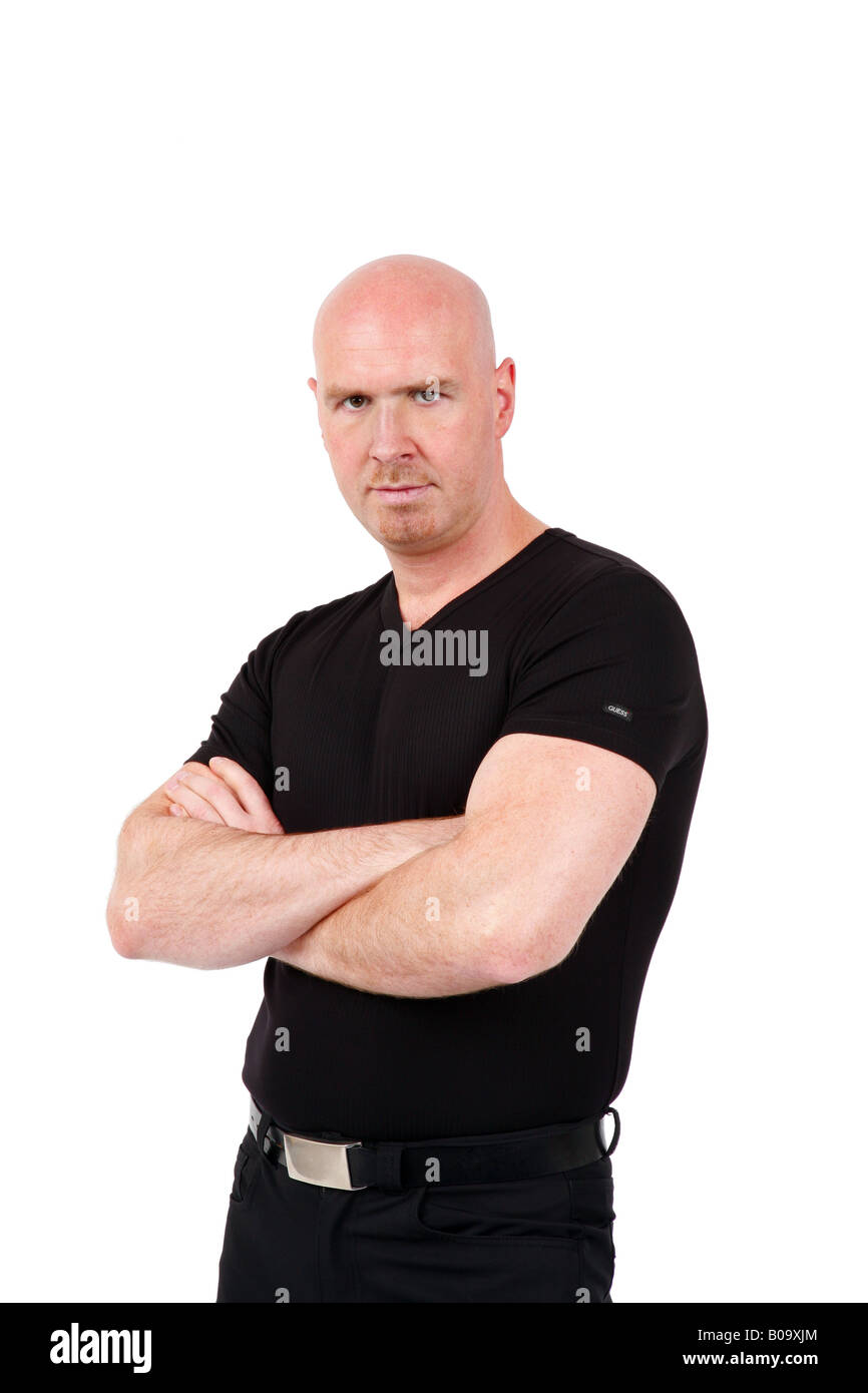 bald headed, young mean man, looking angry into the camera Stock Photo ...