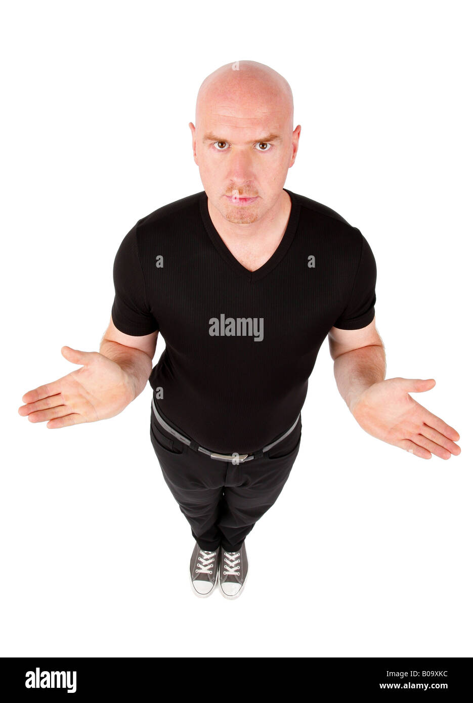 bald headed man looking apologetic into the camera Stock Photo - Alamy