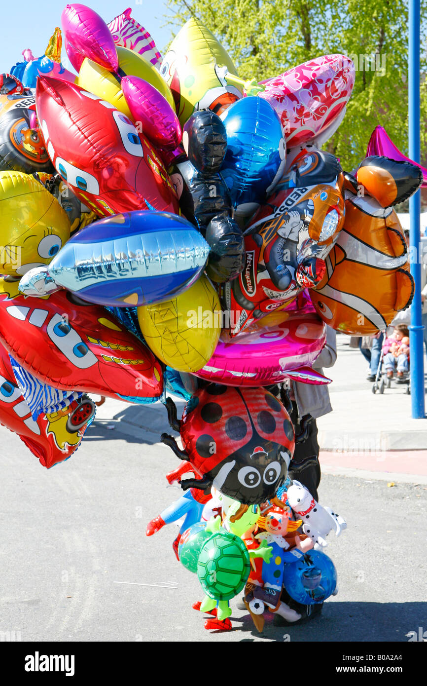 Balloon seller in a fair Stock Photo - Alamy