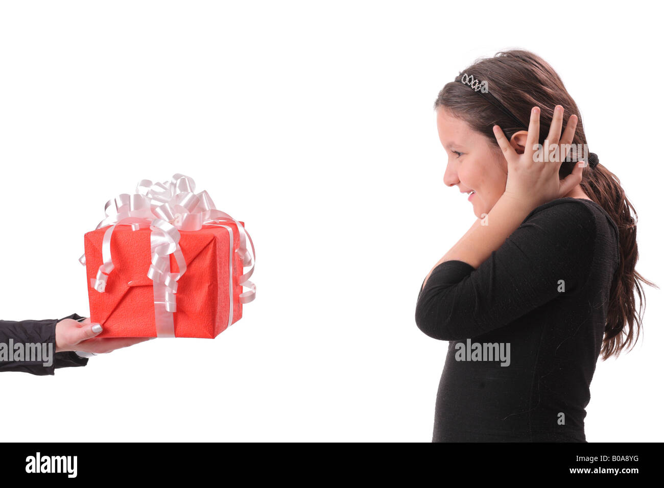 Little girl receiving a gift Stock Photo - Alamy