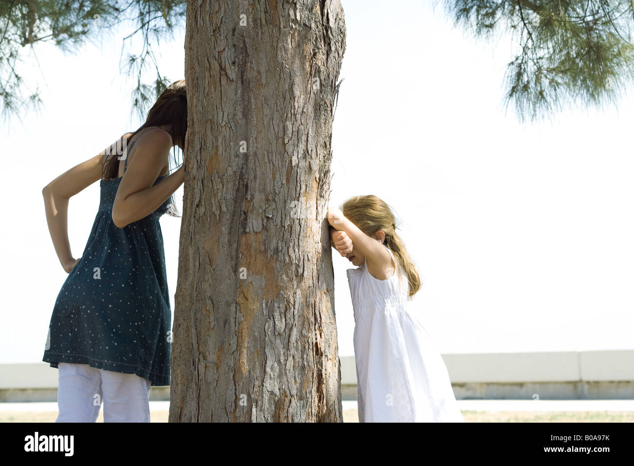 Sisters playing hide seek in hi-res stock photography and images - Alamy