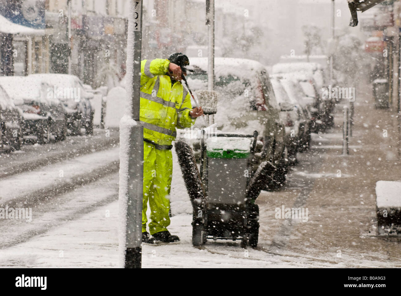 Snow street cleaner working Stock Photo - Alamy