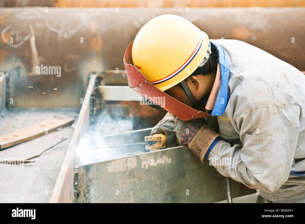 Welder working, side view Stock Photo - Alamy