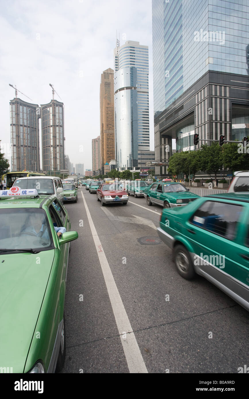 China, Guangzhou, city traffic, high rise buildings in background Stock ...