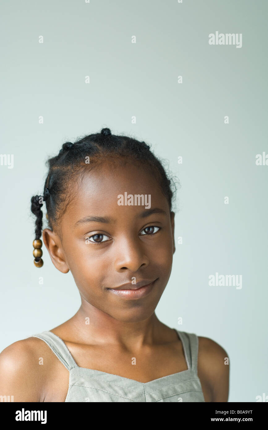 Little girl, smiling at camera, head and shoulders, portrait Stock ...