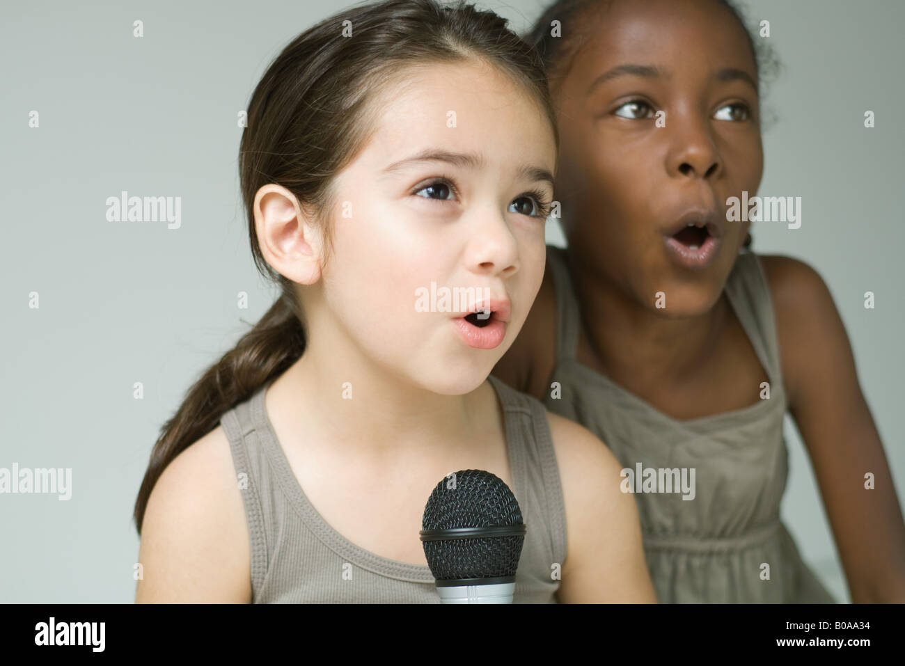 Child friends karaoke hi-res stock photography and images - Alamy