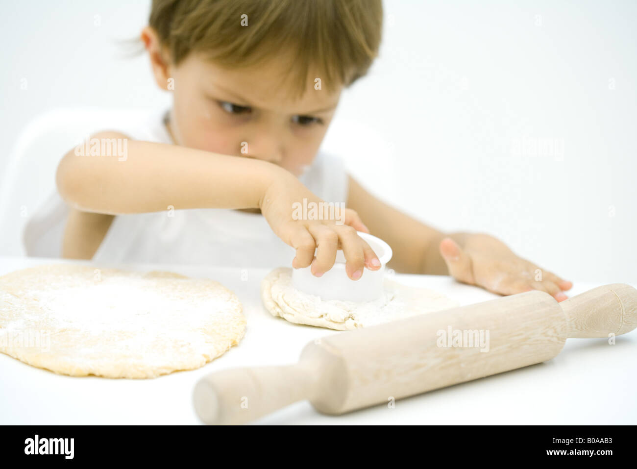 Little boy cutting out shape in dough Stock Photo - Alamy Little boy cutting out shape in dough Stock Photo - Alamy