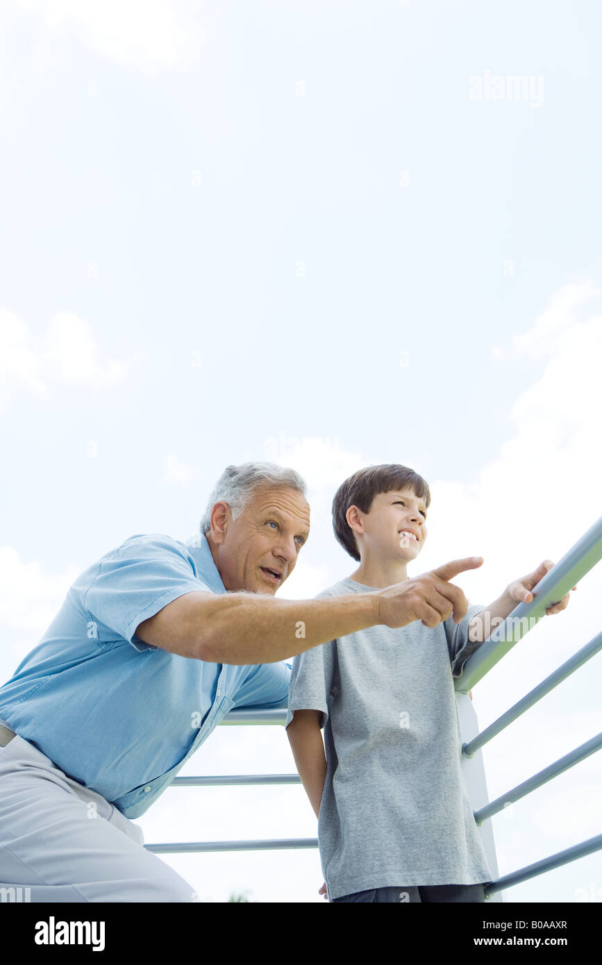 Child leaning over railing hi-res stock photography and images - Alamy