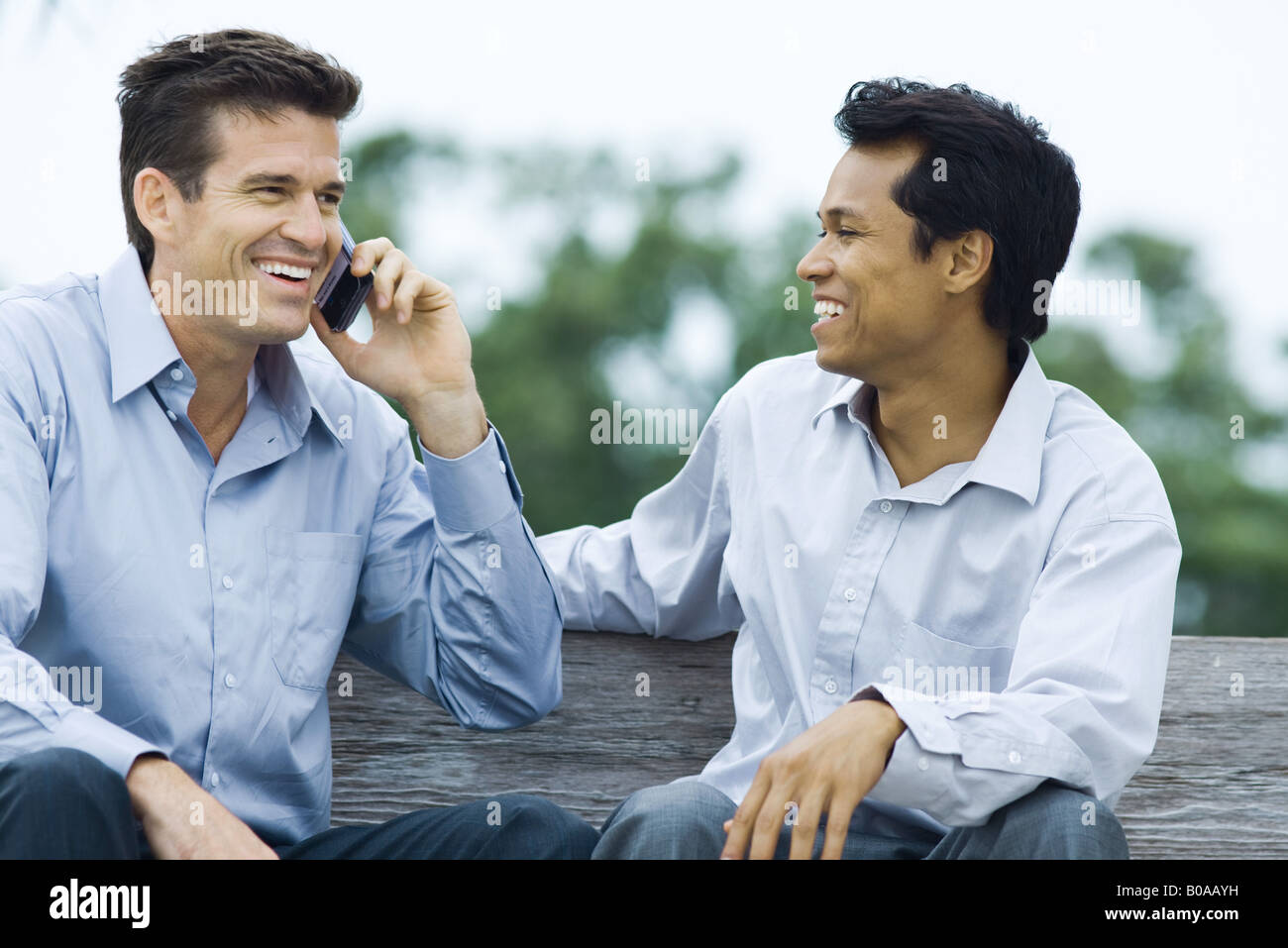 Two men one phoning hi-res stock photography and images - Alamy