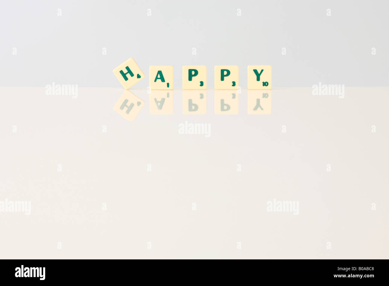 Spelling out words with scrabble tiles hi-res stock photography and ...