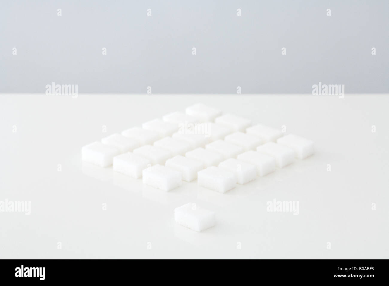 Sugar cubes arranged on table Stock Photo - Alamy